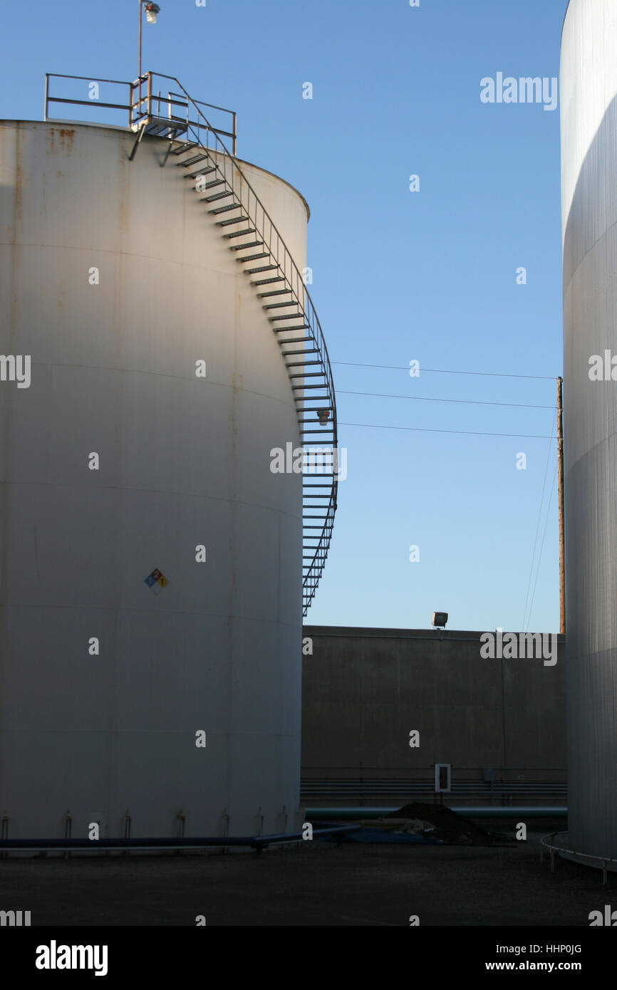 Staircase curving around storage tank Stock Photo - Alamy