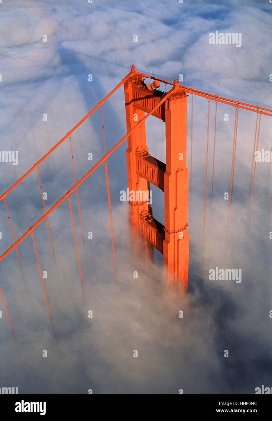 Aerial view of orange bridge over fog Stock Photo - Alamy