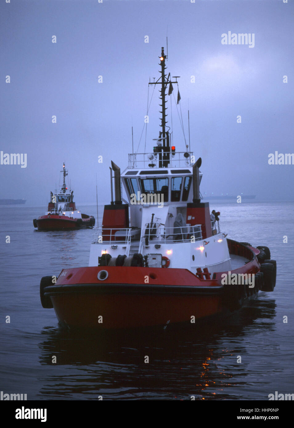 Tugboat at night Stock Photo - Alamy