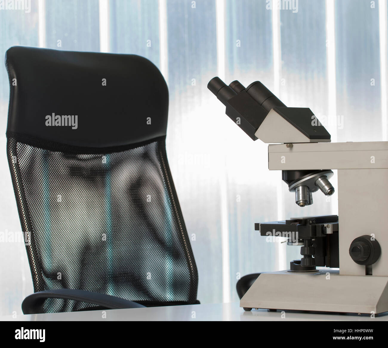Chair and microscope Stock Photo - Alamy