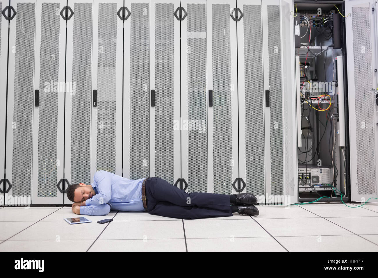 Man sleeping in data center hi-res stock photography and images - Alamy