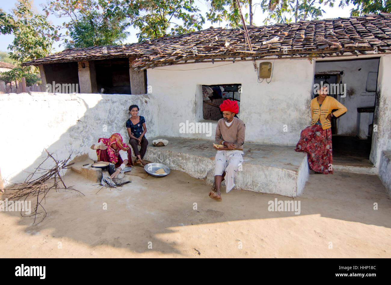 Woman cooking food on firewood Stock Photo - Alamy