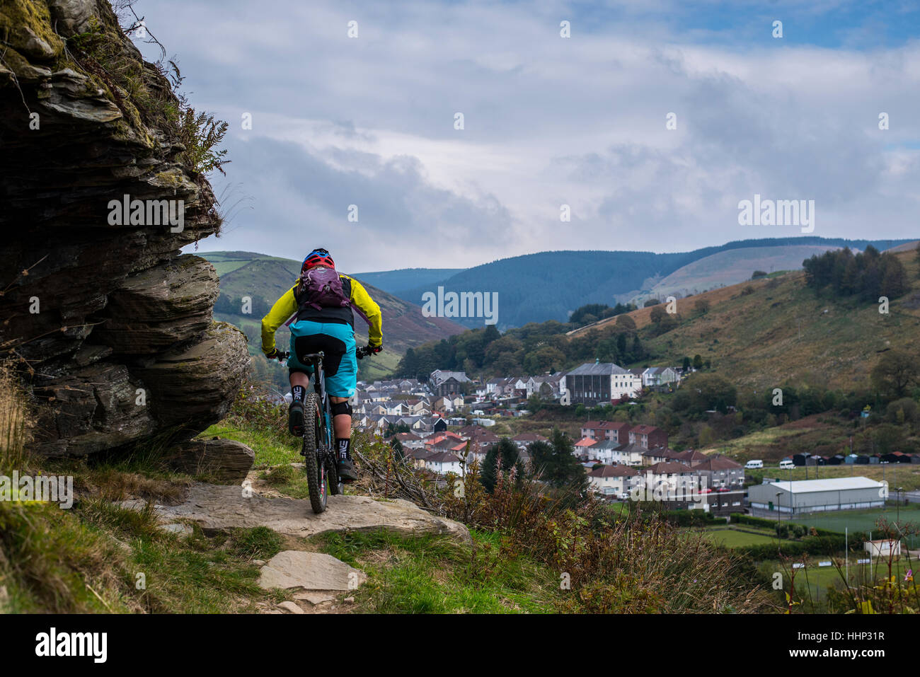A female mountain biker rides a trail at Glyncorrwg in the Afan Valley ...