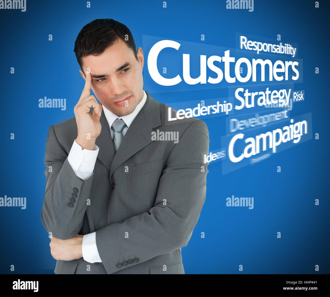 Businessman standing thinking finger at head blue background Stock ...