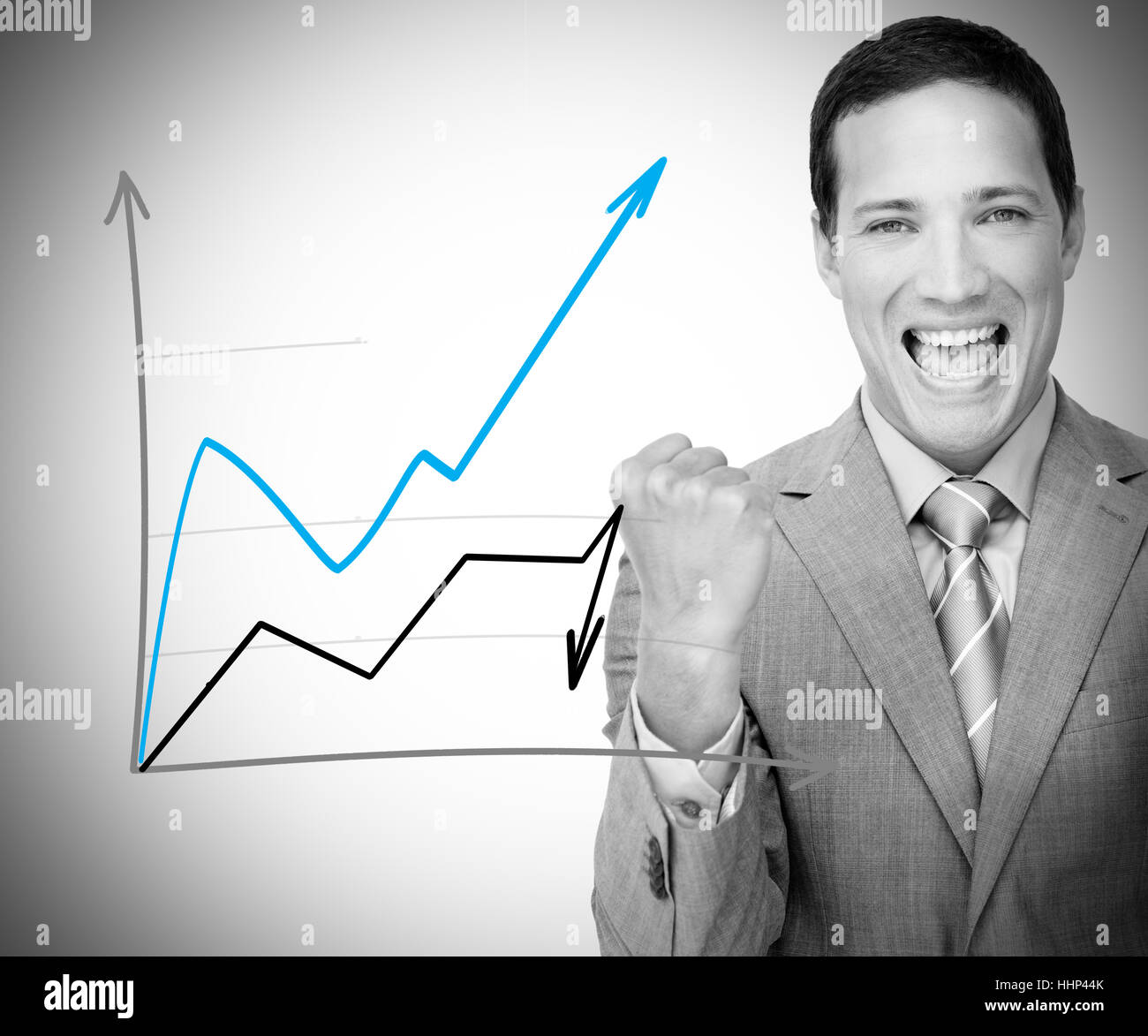 Businessman standing behind blue and black graph cheering Stock Photo ...