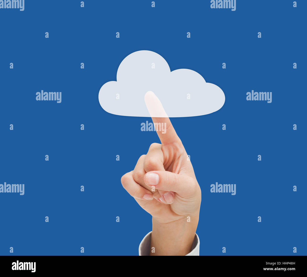 Finger pointing to a graphic cloud on blue background Stock Photo - Alamy