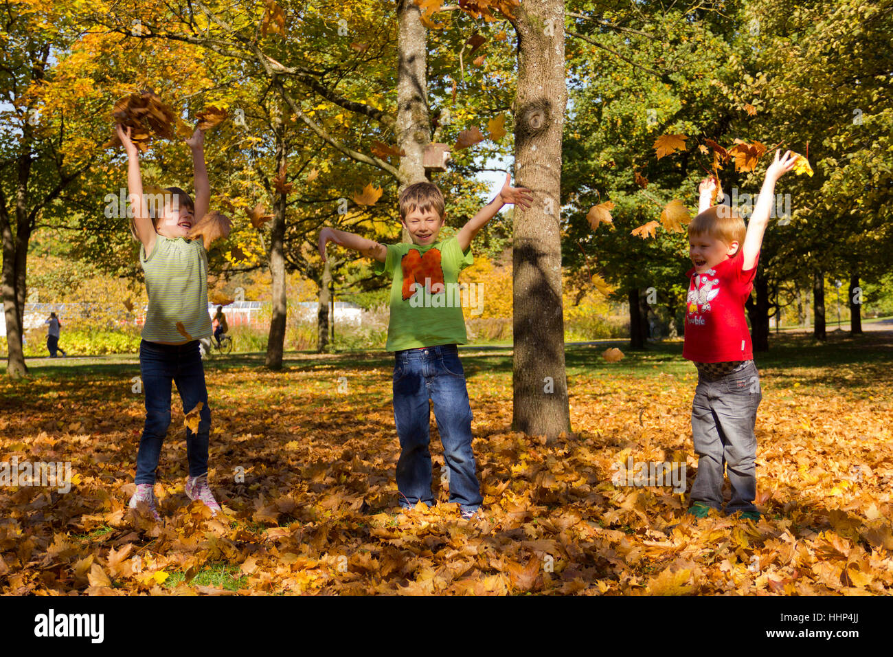children playing in the leaves Stock Photo - Alamy