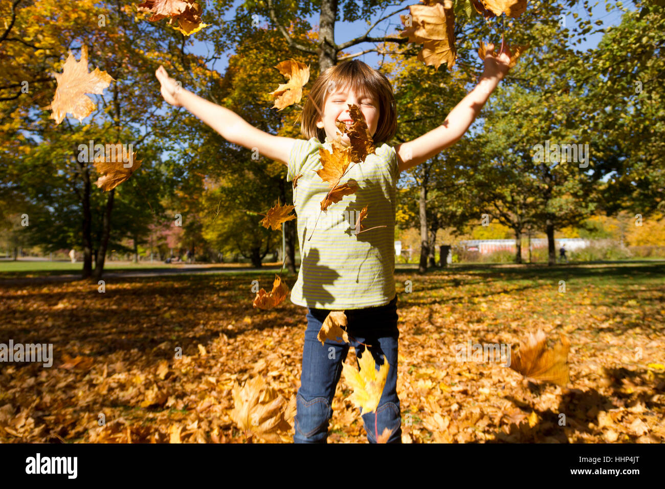 girl throws with foliage Stock Photo - Alamy