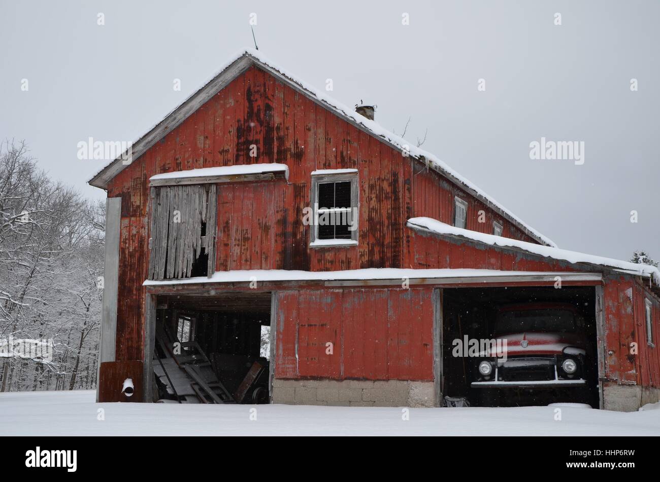 Vintage car in an old red barn Stock Photo - Alamy
