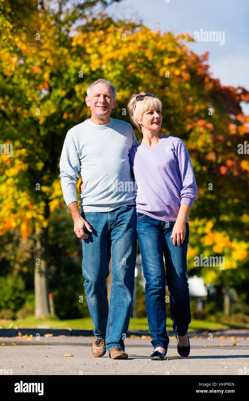 seniors in the autumn on walk in nature Stock Photo - Alamy