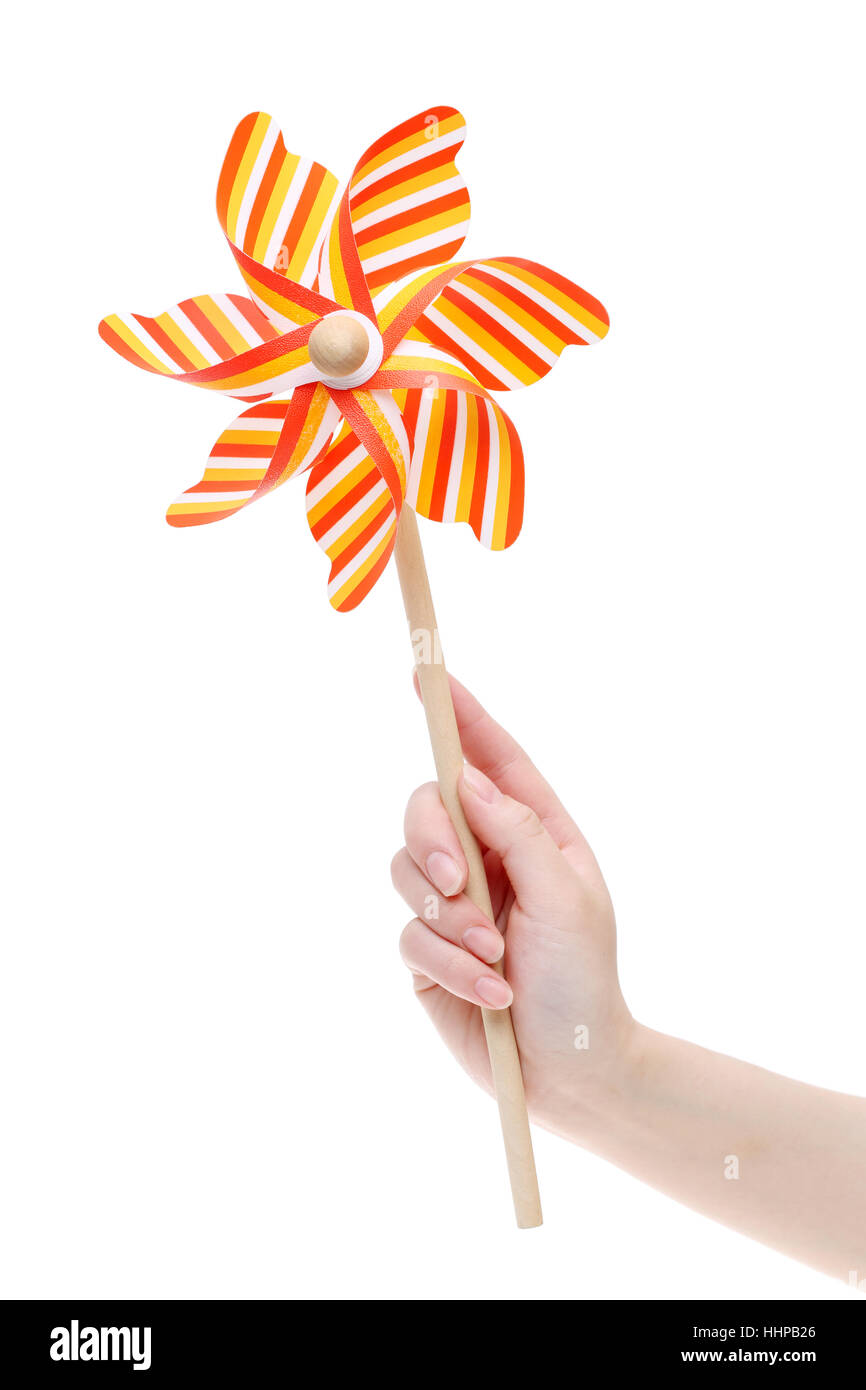 Hand holding colorful toy pinwheel on white background Stock Photo - Alamy