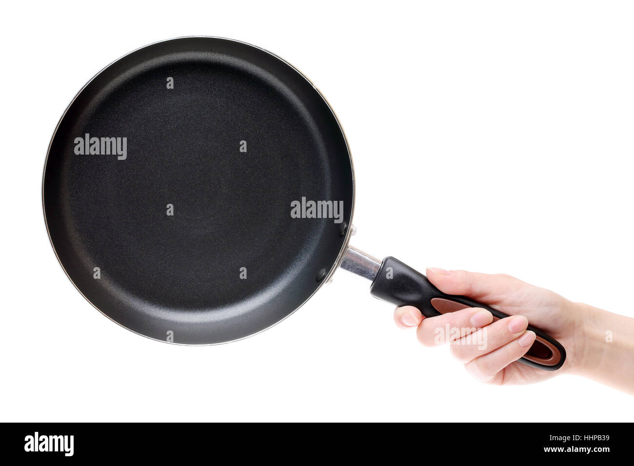 Hand holding frying pan isolated on a white background Stock Photo - Alamy