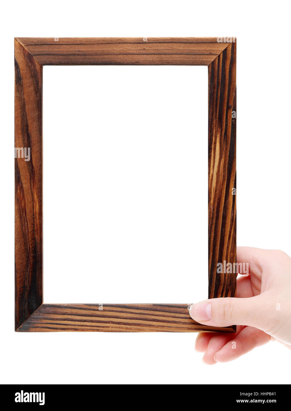 Hand holding wooden picture frame on white background Stock Photo - Alamy