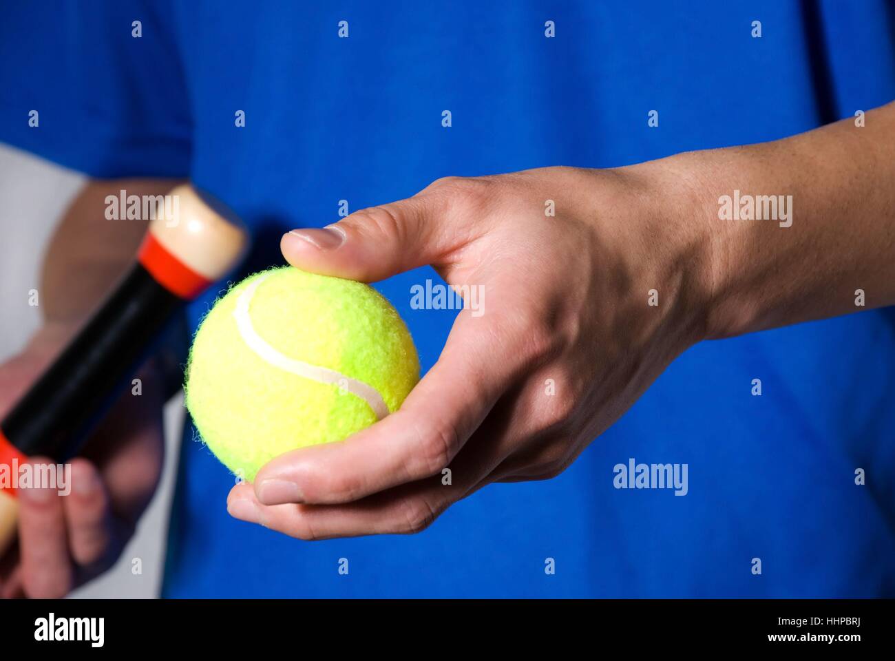 hands holding tennis ball and racket as cutout Stock Photo - Alamy