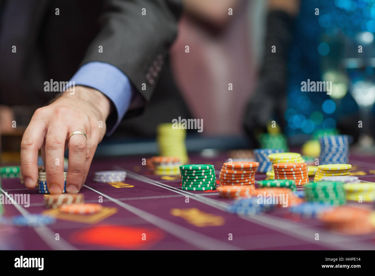 Man placing bet roulette table hi-res stock photography and images - Alamy