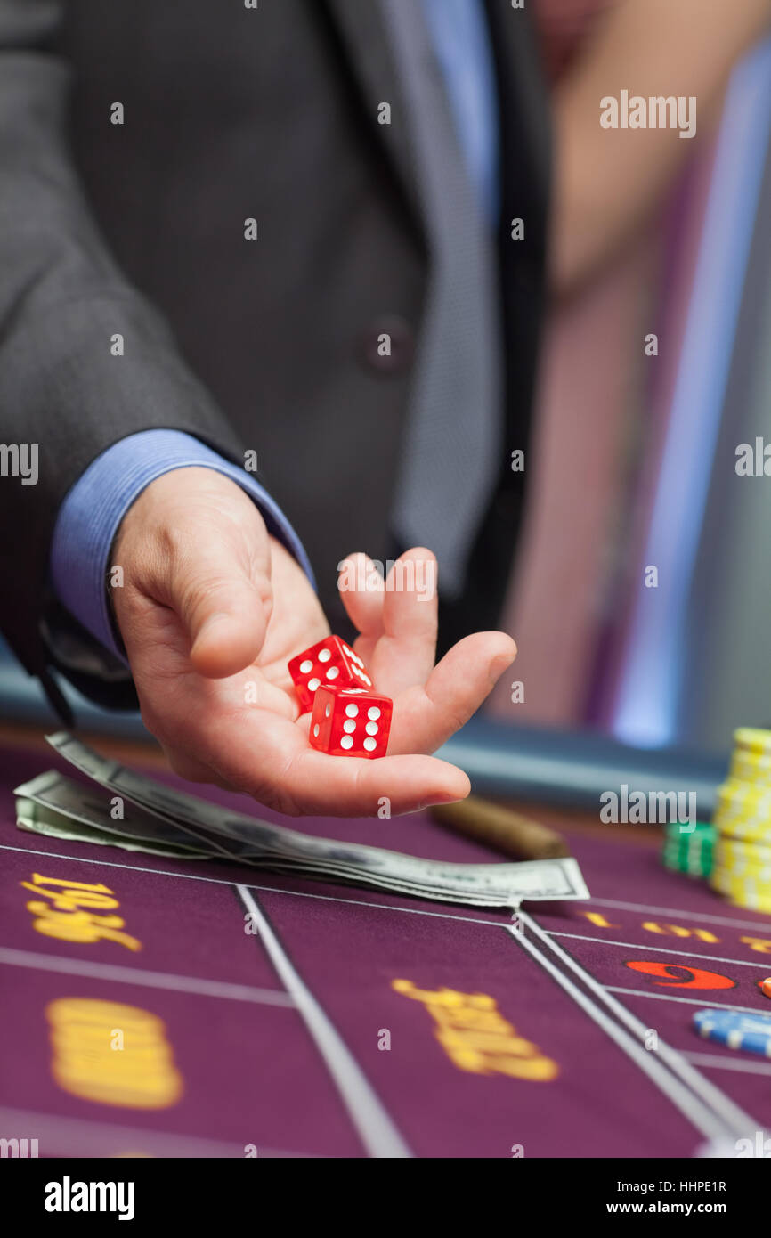 Man throwing dice at craps table hi-res stock photography and images ...