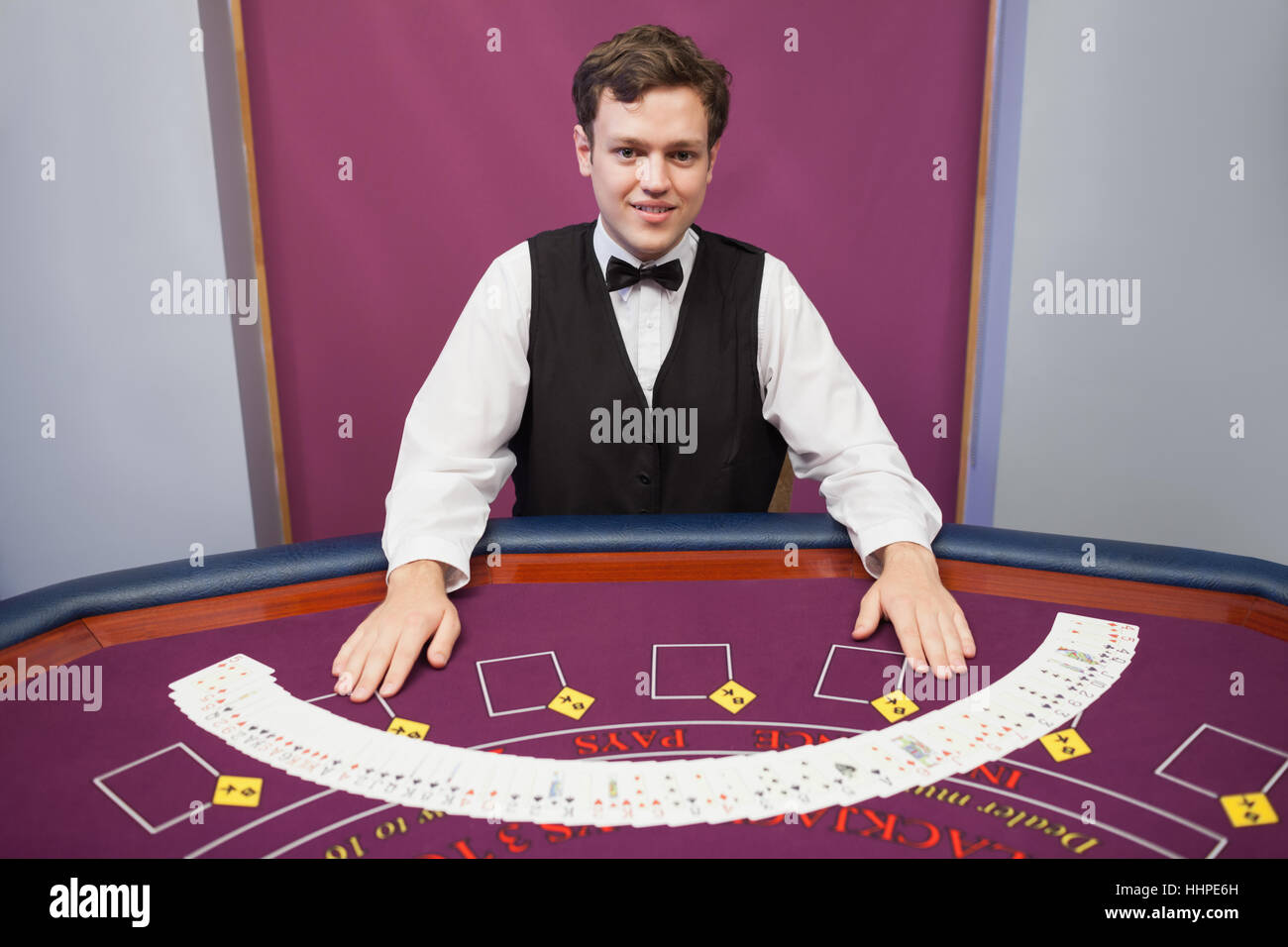 Young man dealing cards hi-res stock photography and images - Alamy