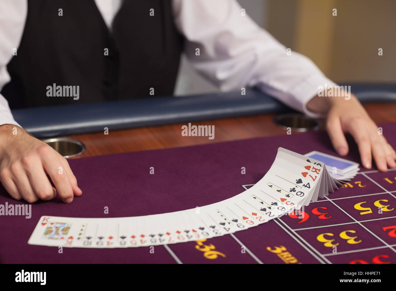 Croupier dealing cards hi-res stock photography and images - Alamy