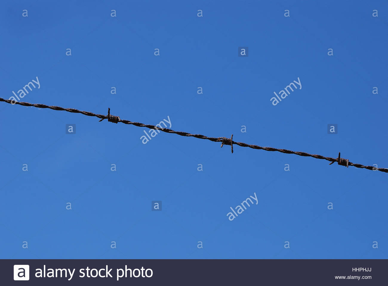 Barbed Wire Fence In Military Stock Photos & Barbed Wire Fence In ...