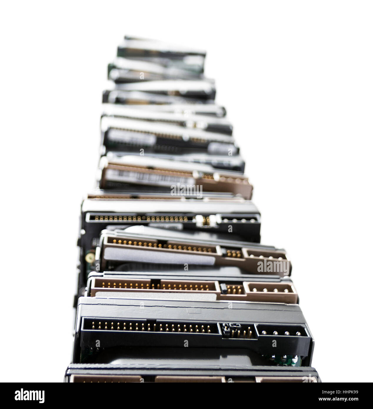 high stack of used hard drives in light background Stock Photo - Alamy