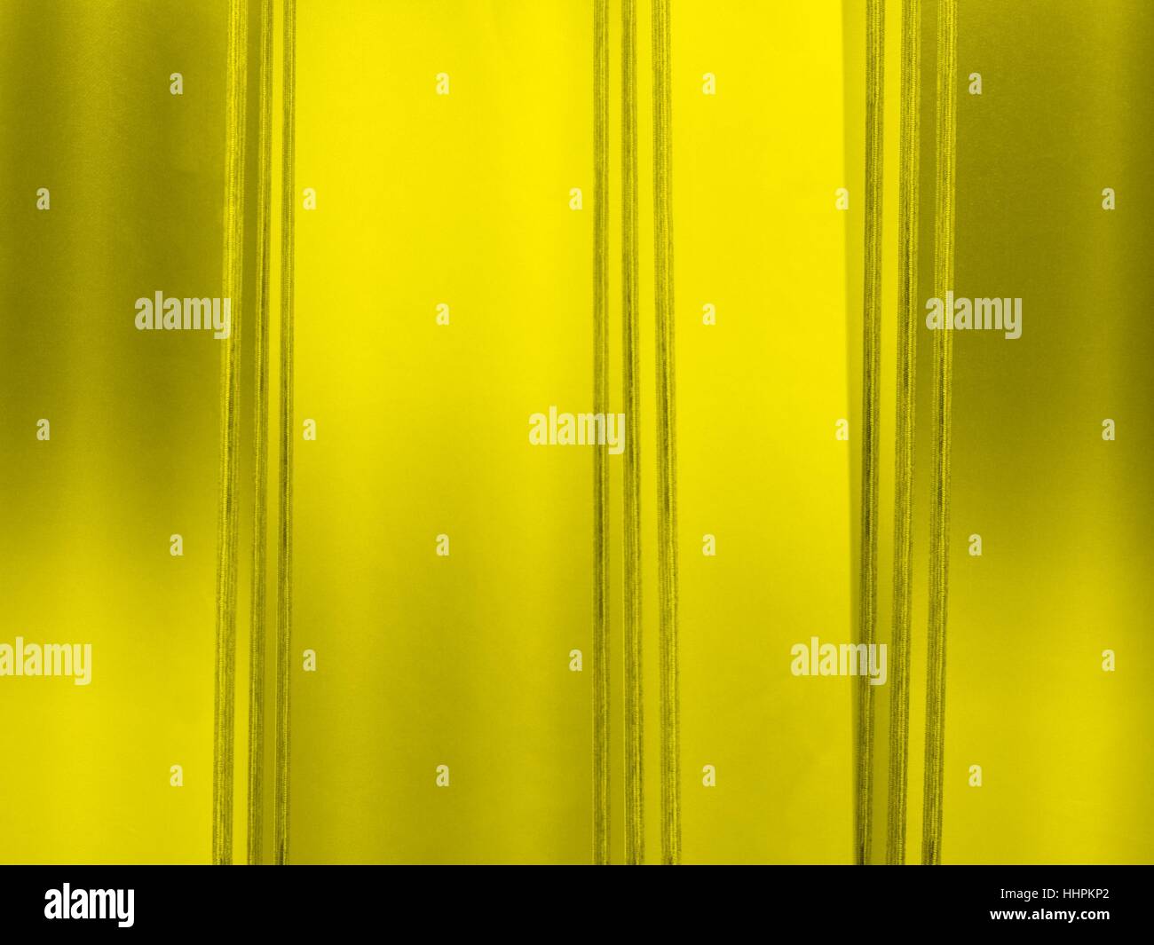 Abstract background of a yellow drapery Stock Photo - Alamy