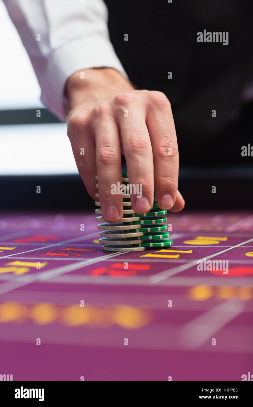 Placing bet on roulette table hi-res stock photography and images - Alamy