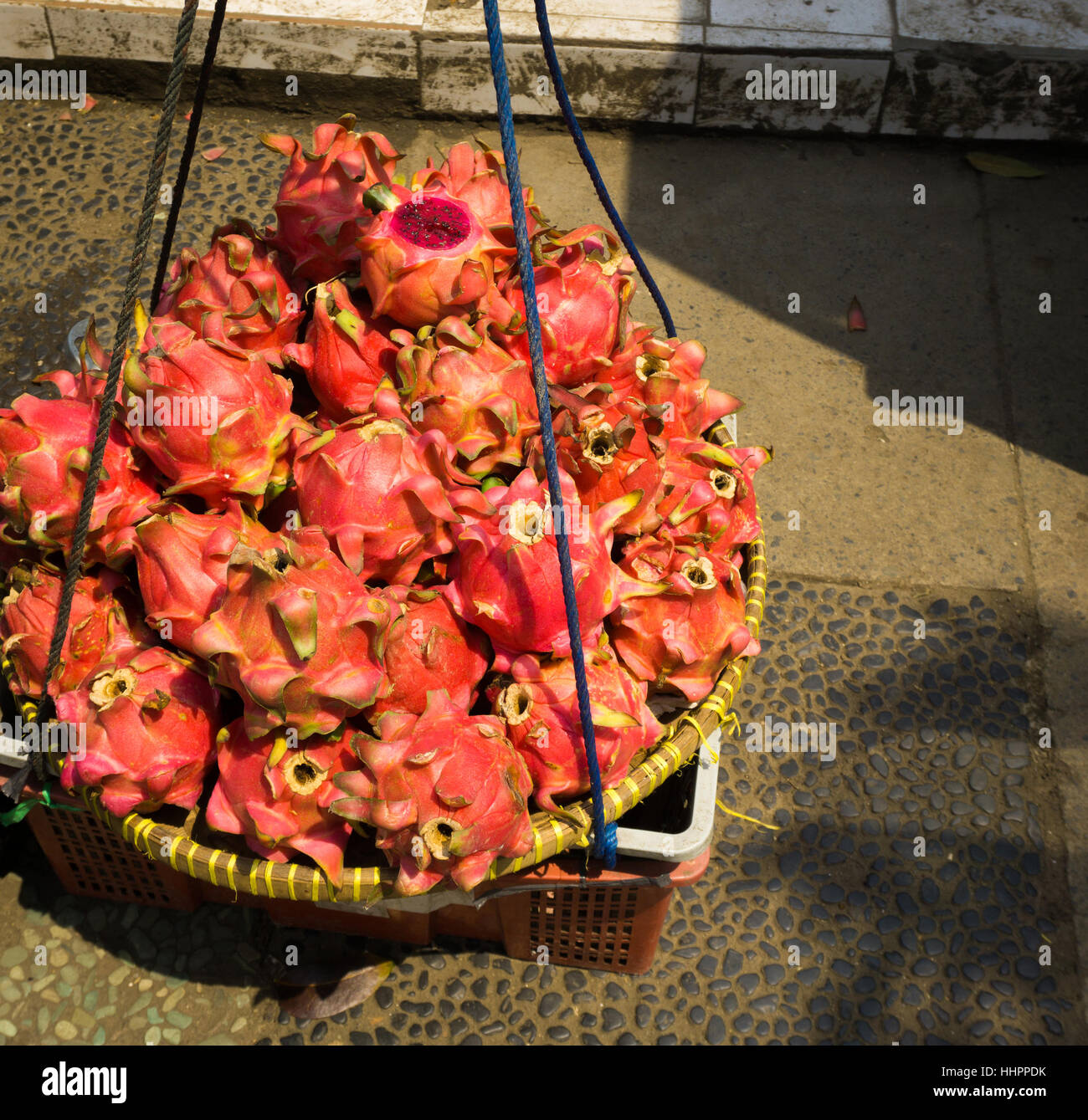 Selling red dargon fruits in a bamboo basket photo taken in depok ...