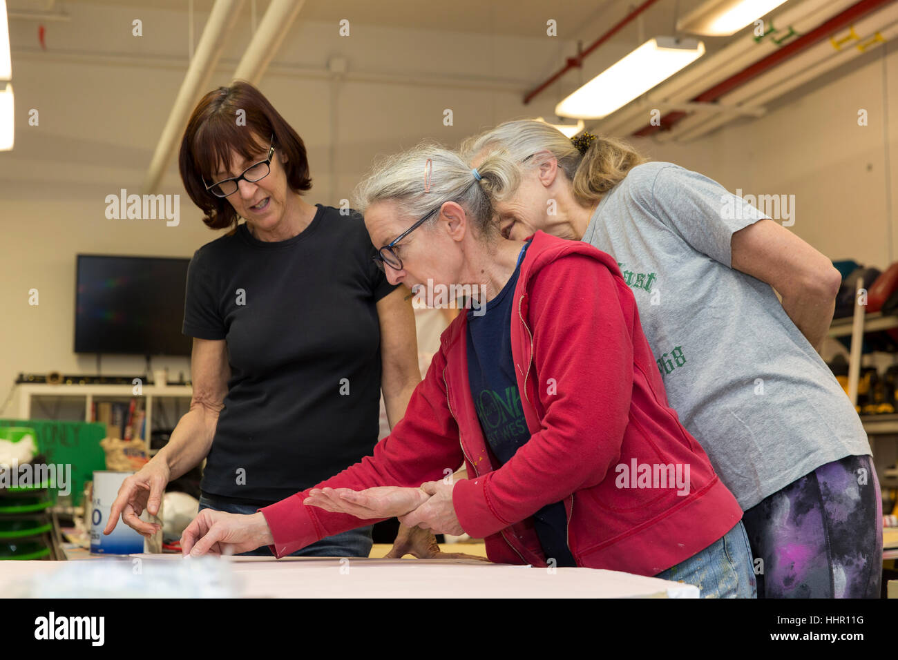 Seattle, USA. 19th Jan, 2017. Norma Baum, center, leads volunteers at ...