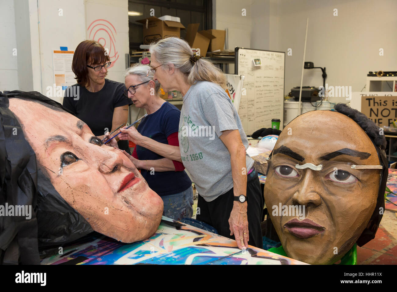 Seattle, USA. 19th Jan, 2017. Norma Baum, center, and volunteers work ...