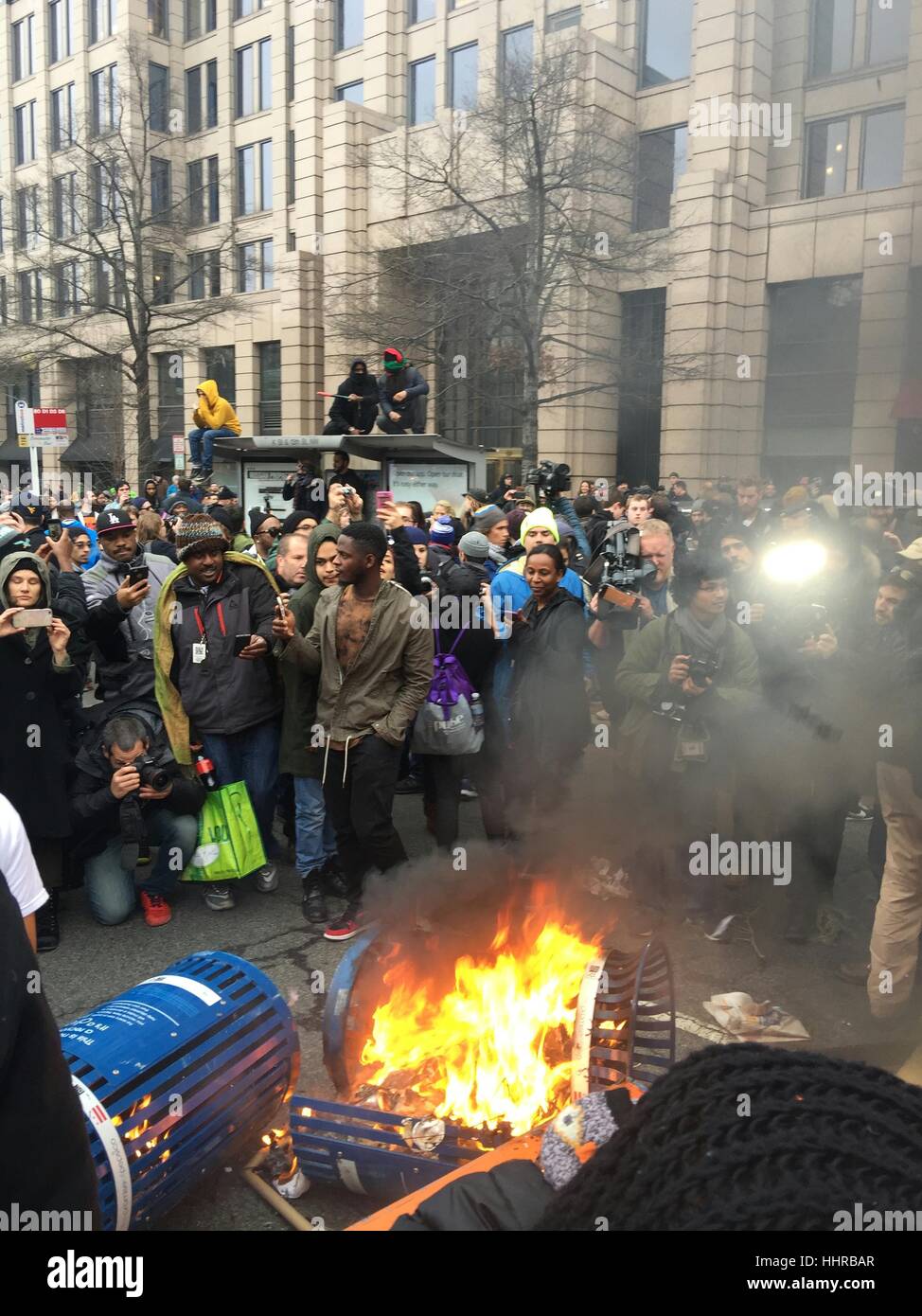 Washington, USA. 20th Jan, 2017. Protesters set fire to trash cans ...