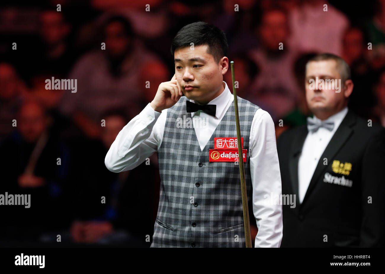 London, UK. 20th Jan, 2017. Ding Junhui(L) of China reacts during the ...