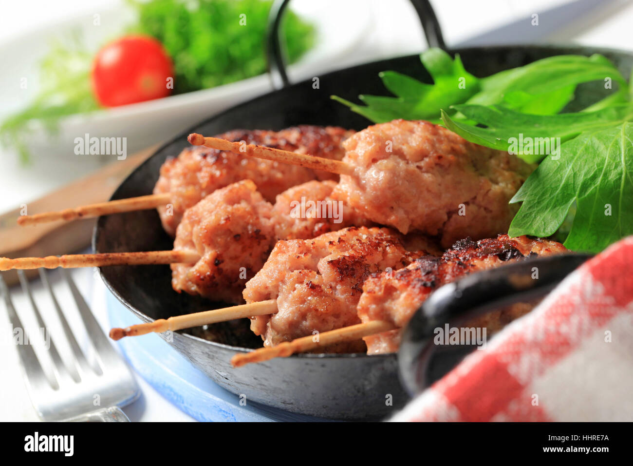 Minced meat kebabs on wooden sticks Stock Photo - Alamy