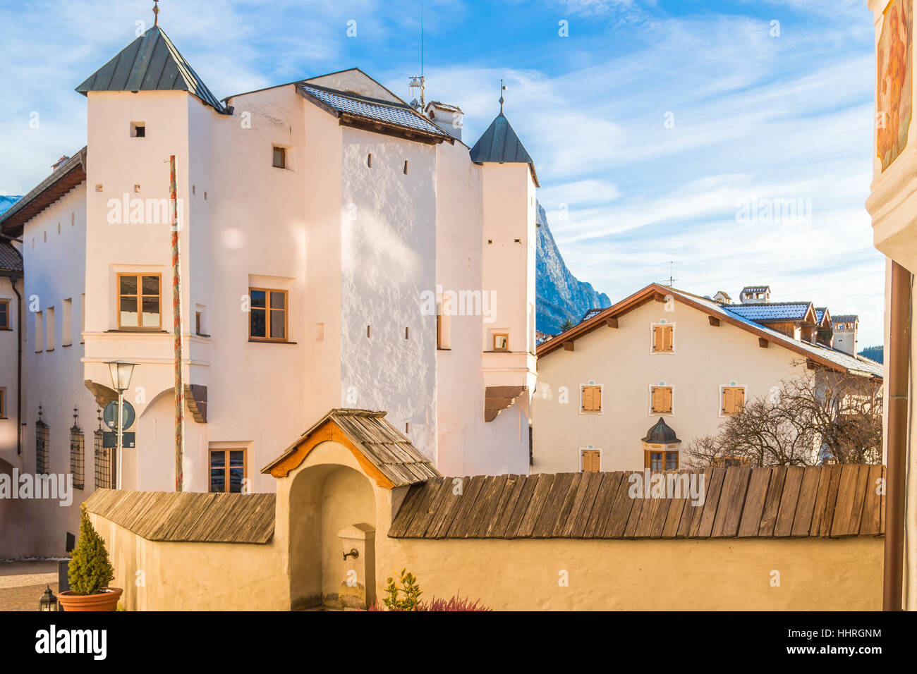 street and buildings of an alpine village in the Italian Dolomites ...
