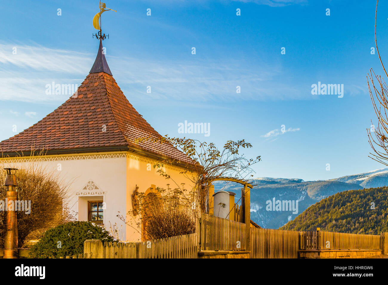 street and buildings of an alpine village in the Italian Dolomites ...