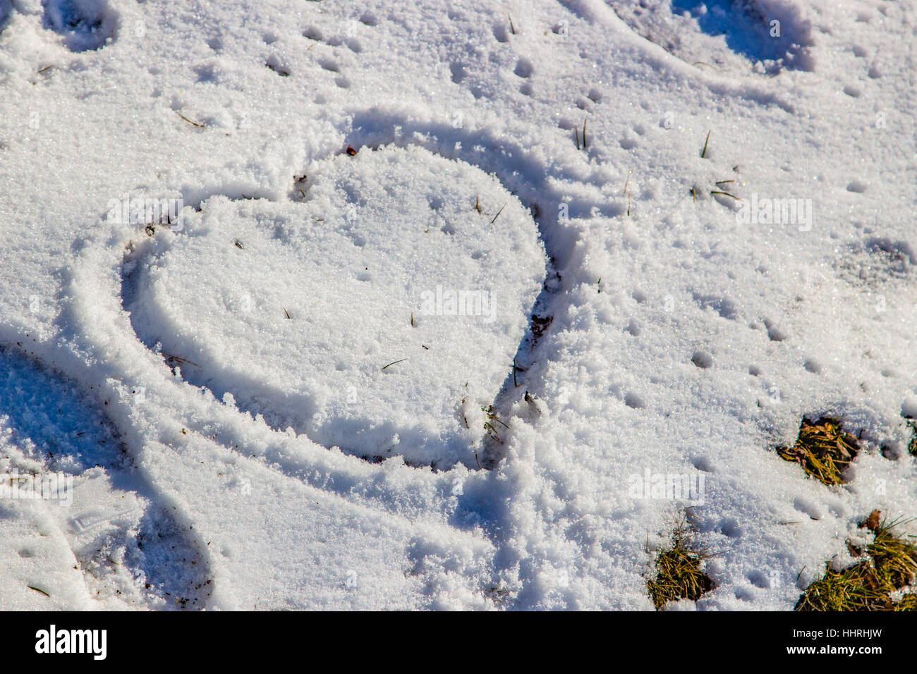 Heart carved into snow hi-res stock photography and images - Alamy