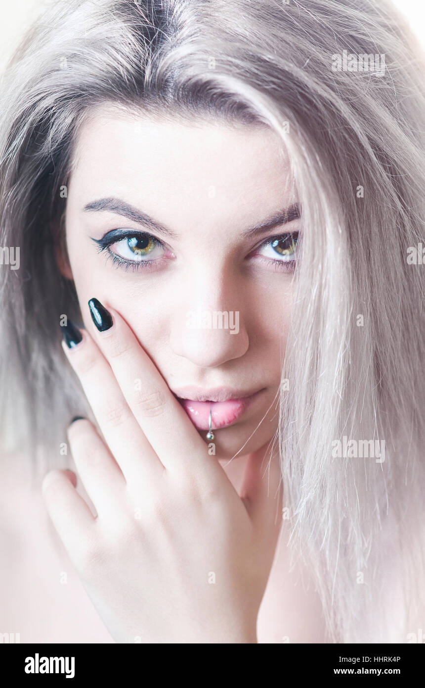 Young woman with gray hair closeup portrait with hand Stock Photo - Alamy