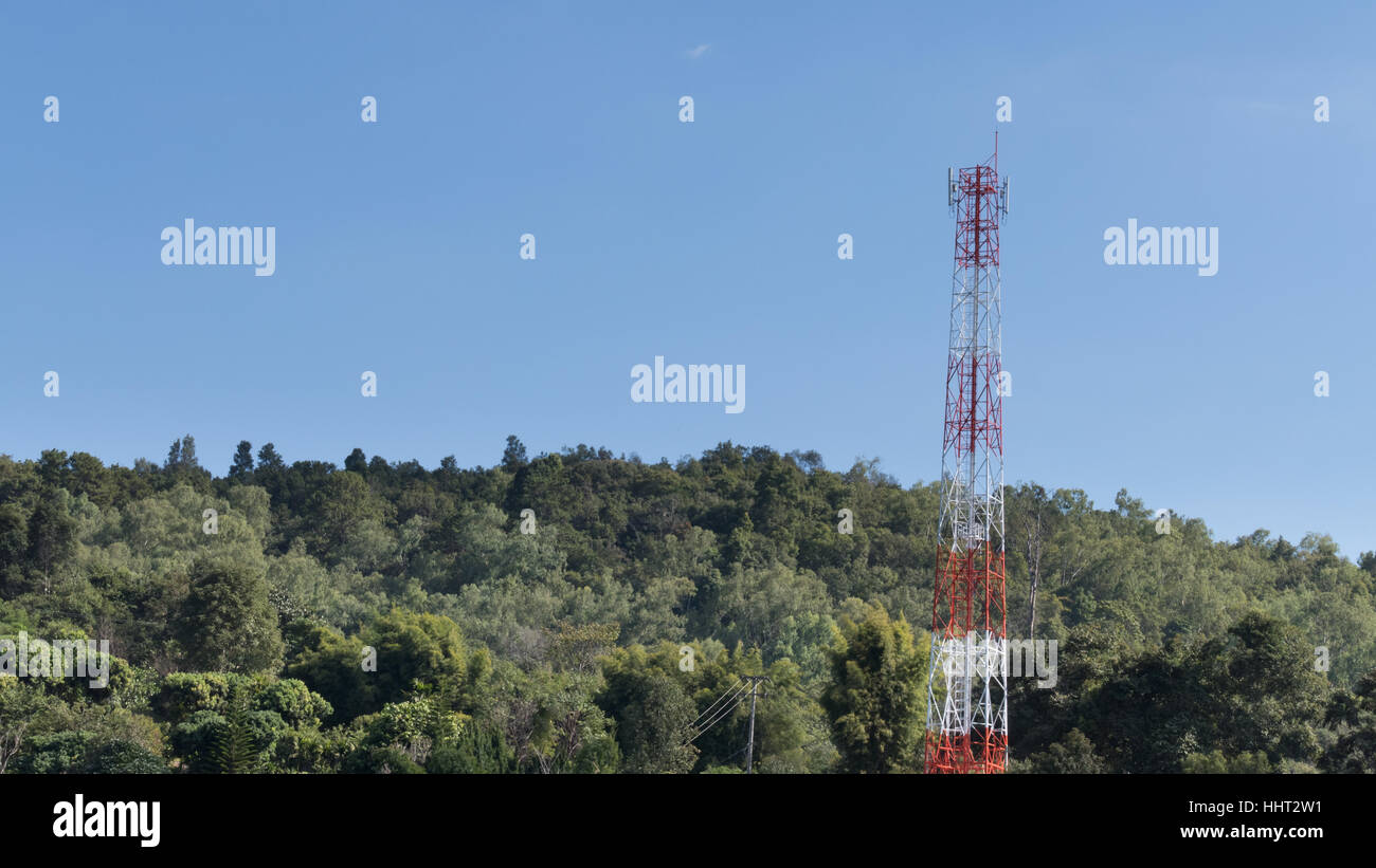 telephone tole, elecommunication tower with forest, mountain and blue ...