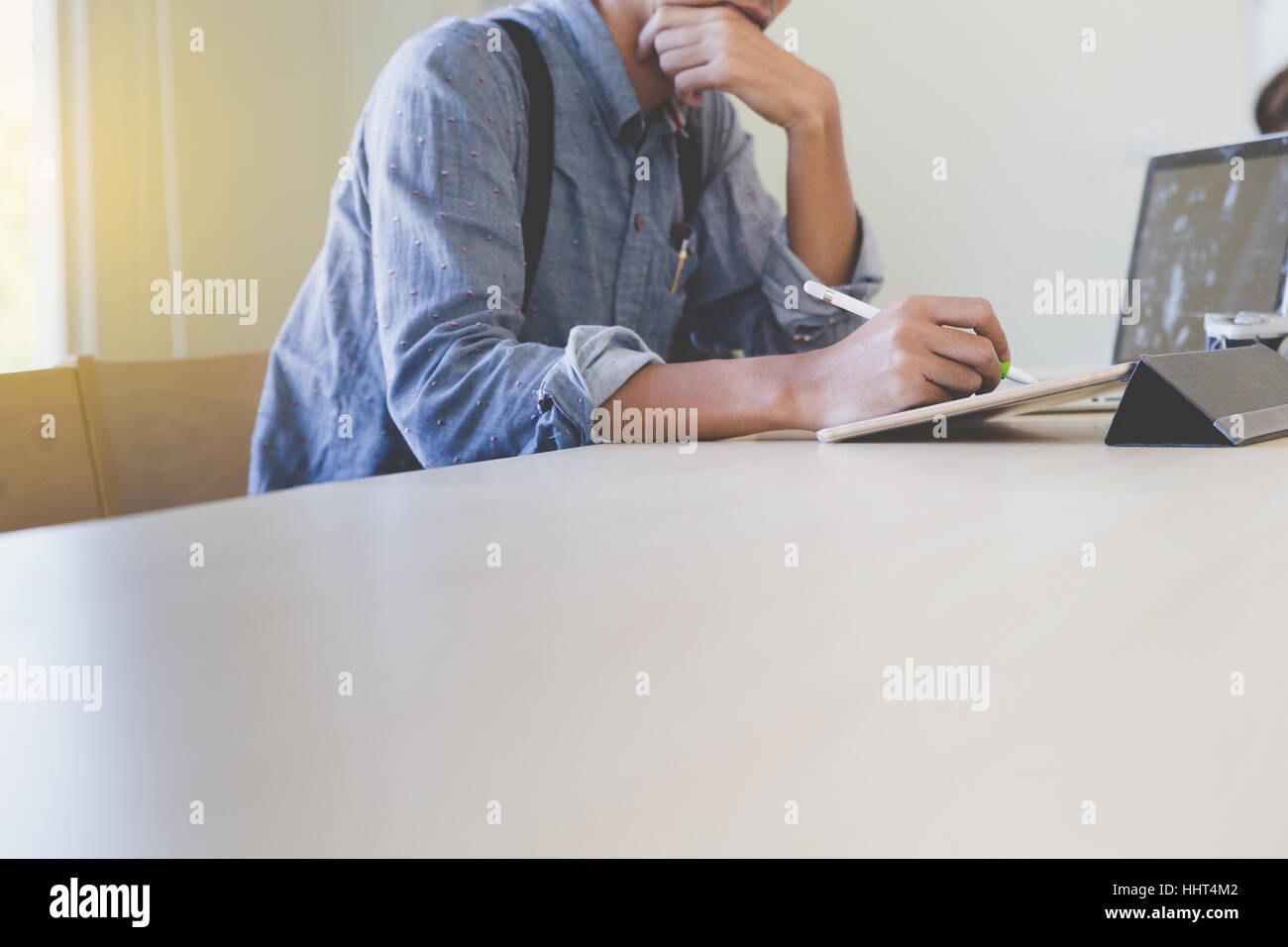 photographer retouching photo, graphic designer drawing image using a ...