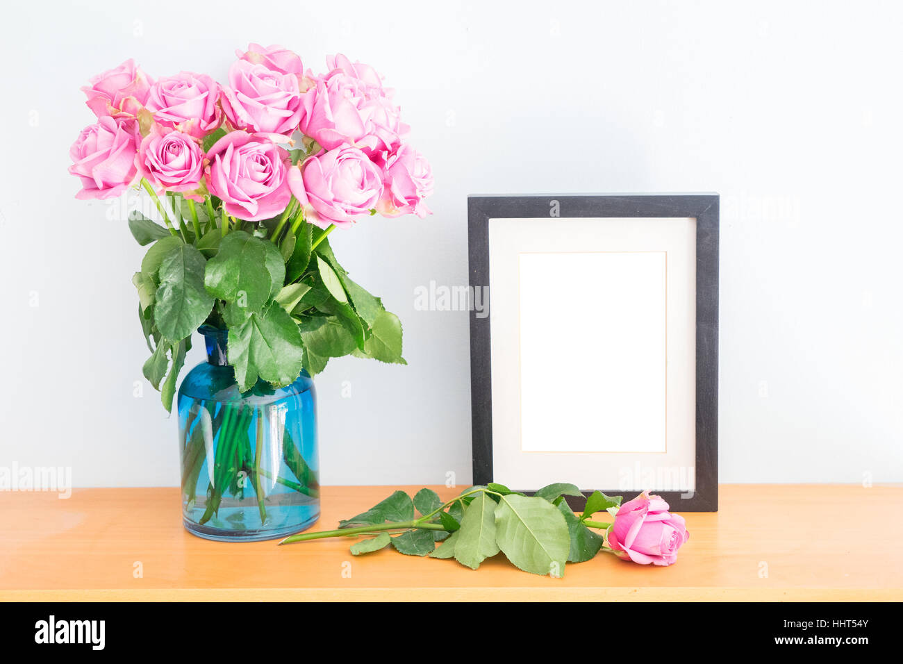 Violet roses with photo frame Stock Photo - Alamy