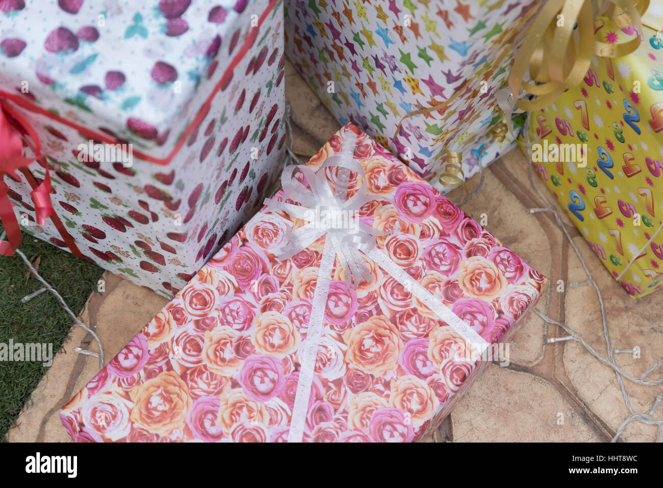 winter rain drop on colorful gift box present on floor, christmas and ...