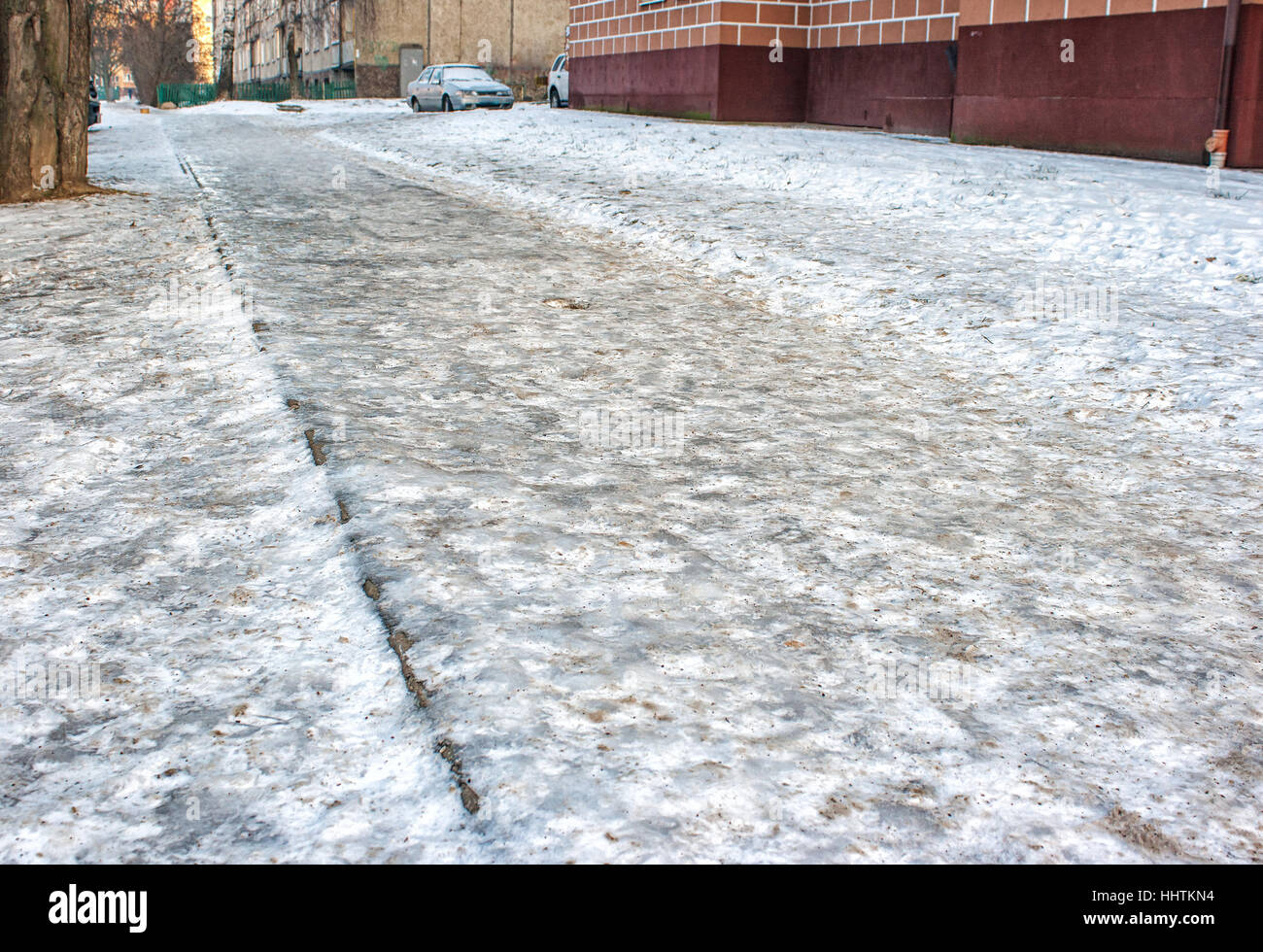pavementd covered with ice in new residential area on cold winter day ...