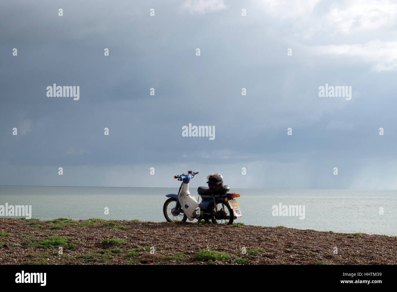 Honda 50 moped parked on the beach, Bawdsey, Suffolk, UK Stock Photo ...