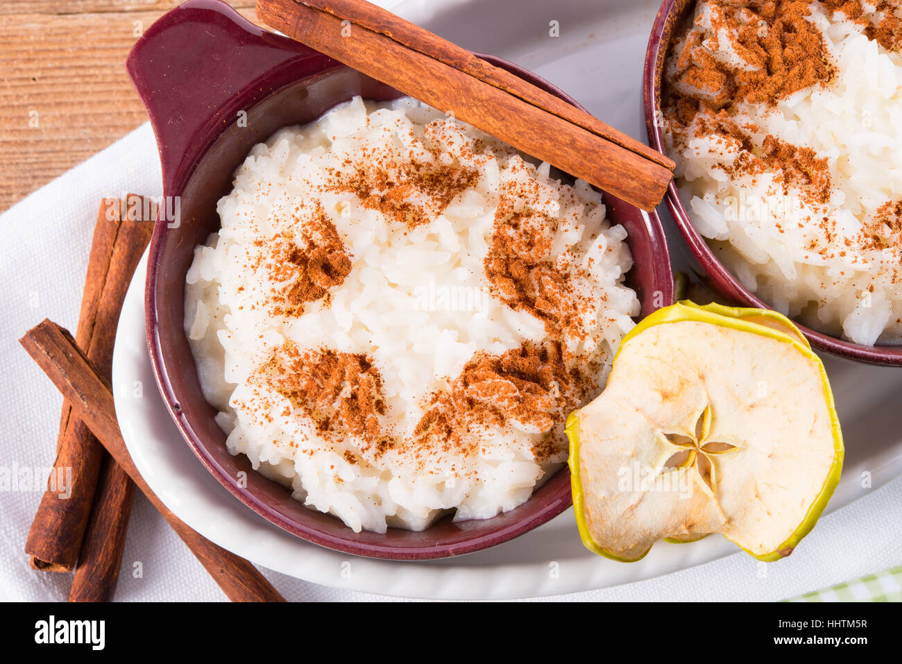 milk rice with cinnamon and applesauce Stock Photo - Alamy