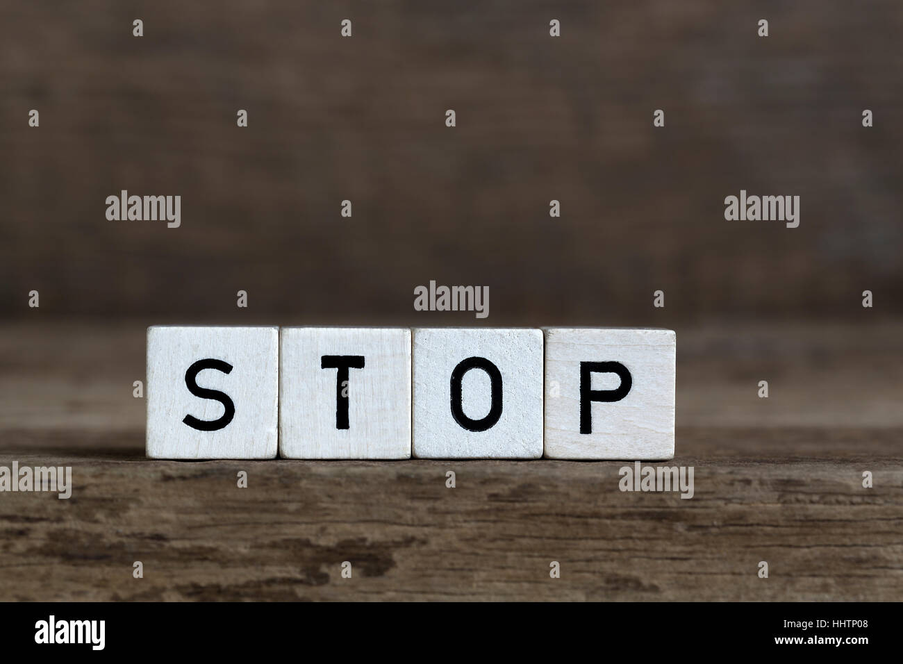 Stop, written in cubes on wooden background Stock Photo - Alamy