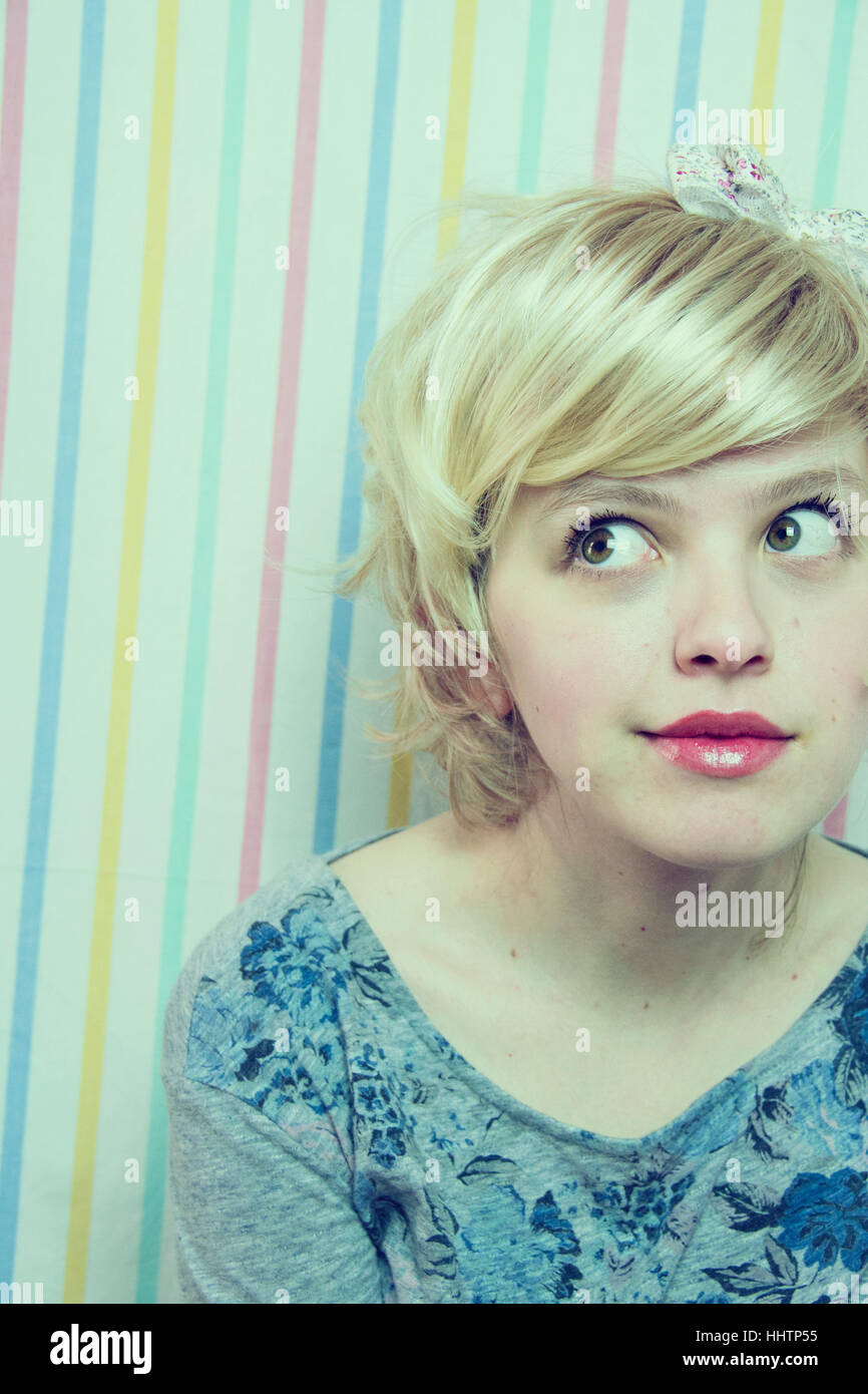 Young blond woman with a sweet look Stock Photo - Alamy