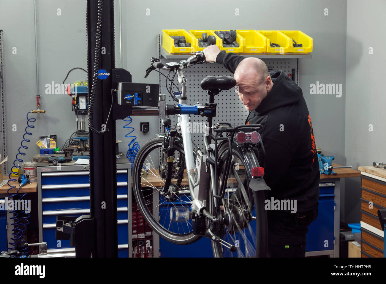 Bicycle mechanic during inspection mountain hi-res stock photography ...