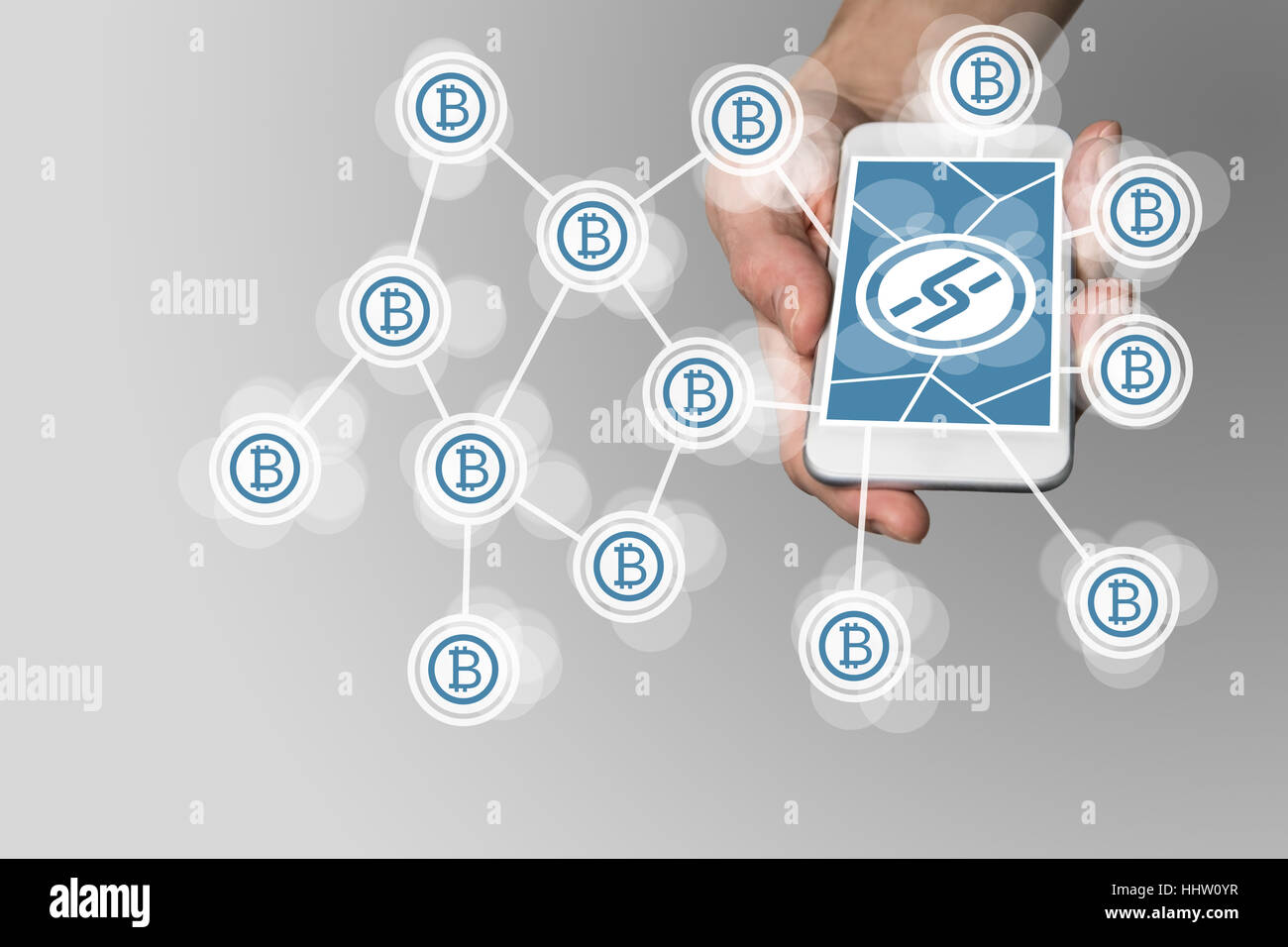 Blockchain and bitcoin concept with hand holding modern smart phone as ...