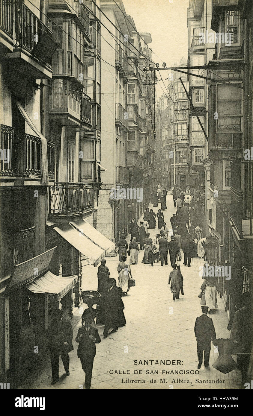 Santander street, Calle de San Francisco. Woman carrying basket on her ...