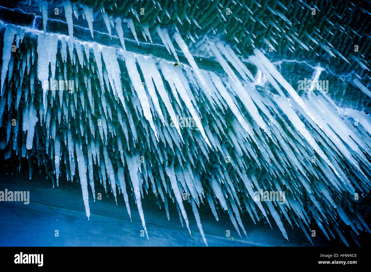 Lot of sharp and long icicles Stock Photo - Alamy