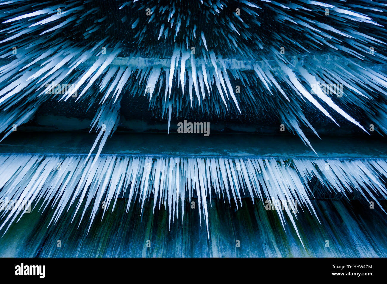 Lot of sharp and long icicles Stock Photo - Alamy